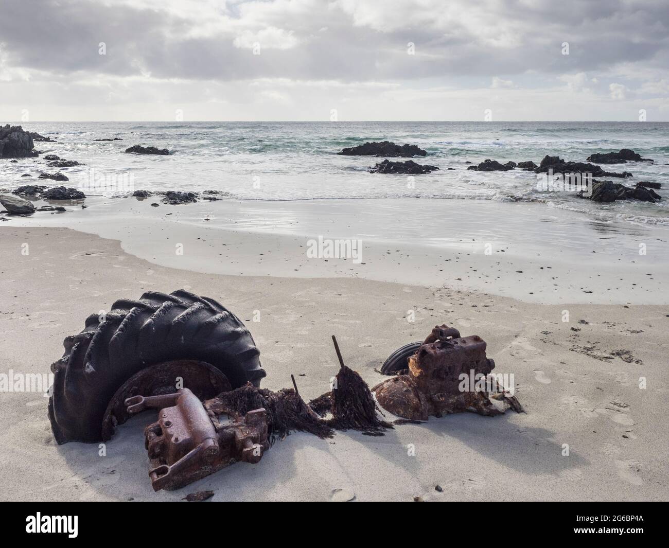 Old tractor caught by the tide and buried in the sand, Snelling Beach ...