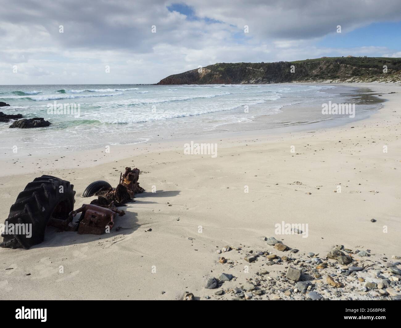 Old tractor caught by the tide and buried in the sand, Snelling Beach ...