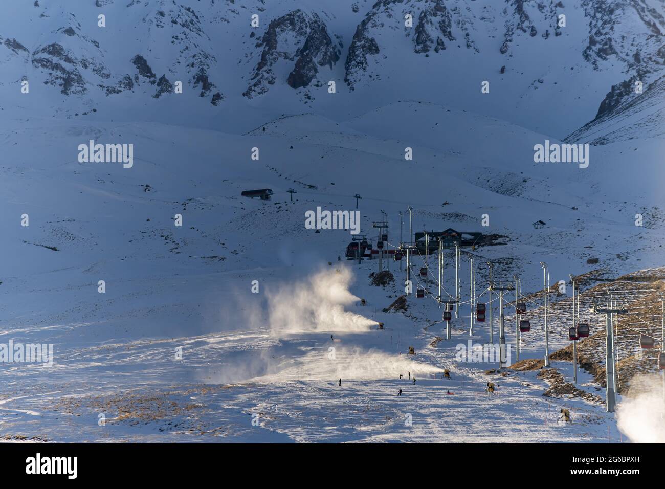 Ski slope with snow maker machine, or snow gun, during daylight Stock ...