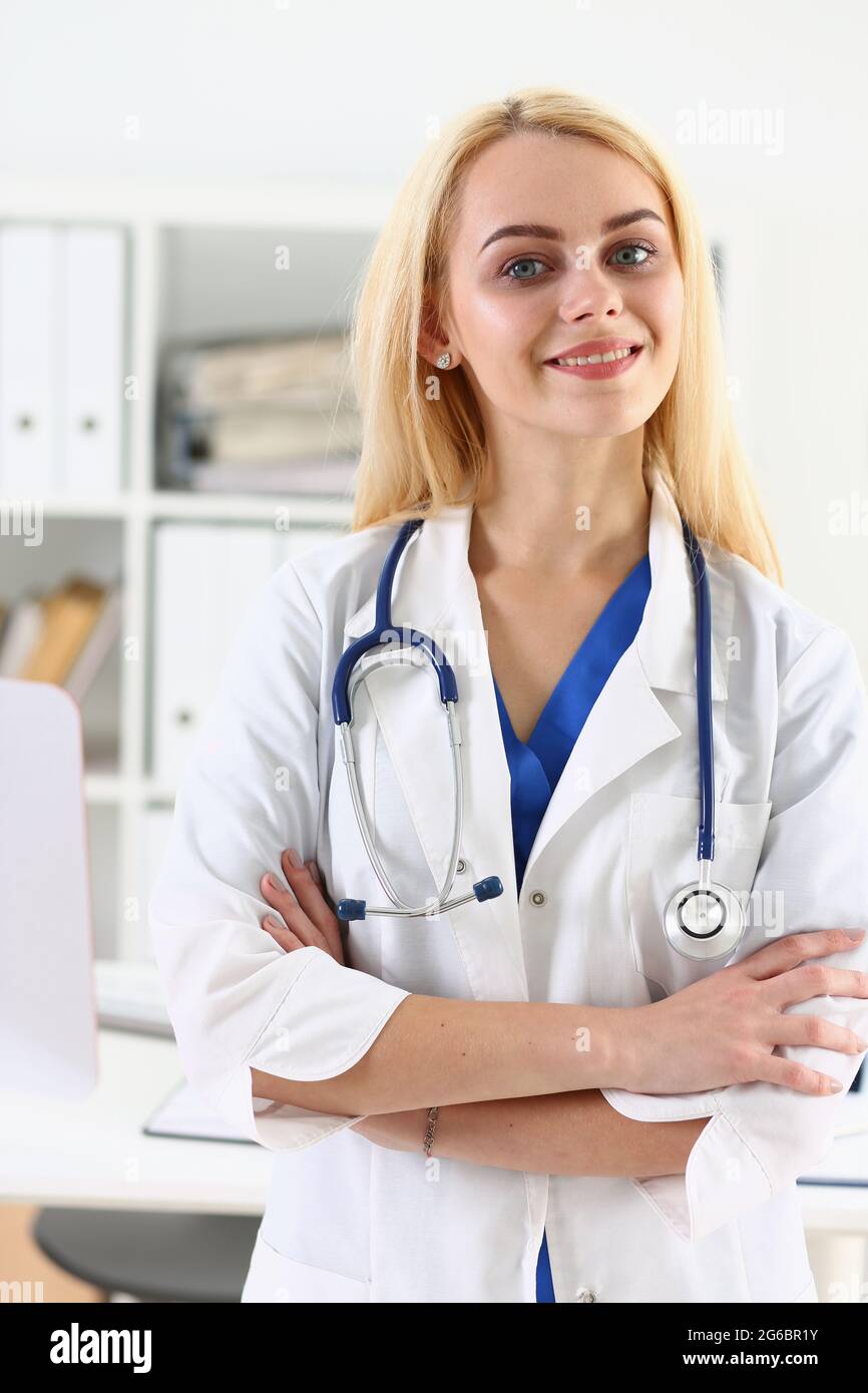 Beautiful smiling female doctor stand in office portrait Stock Photo ...
