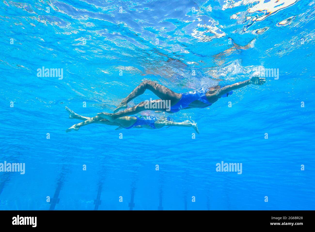Women swimming underwater hi-res stock photography and images - Alamy