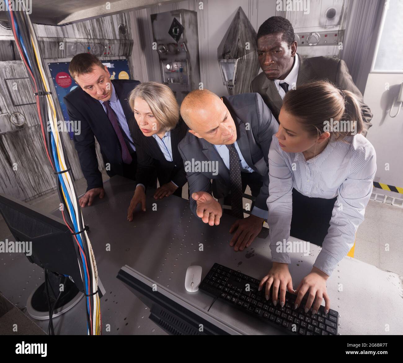 People trying to get out of escape room Stock Photo - Alamy