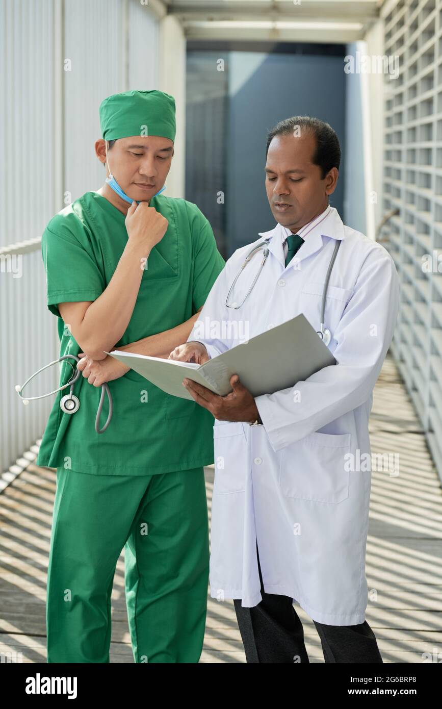 Pensive serious doctors reading hi-res stock photography and images - Alamy