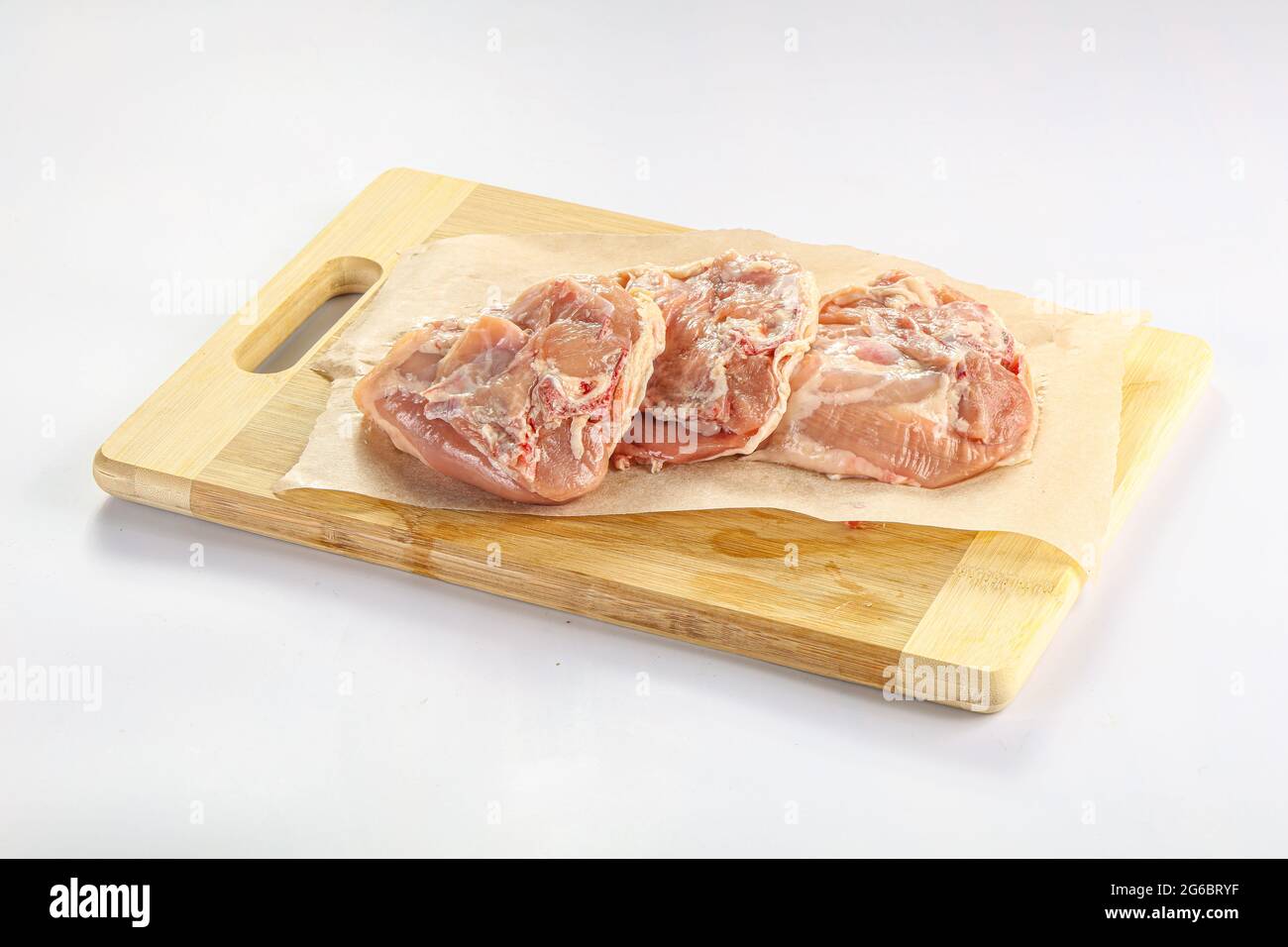 Raw chicken leg fillet uncooked over board Stock Photo - Alamy