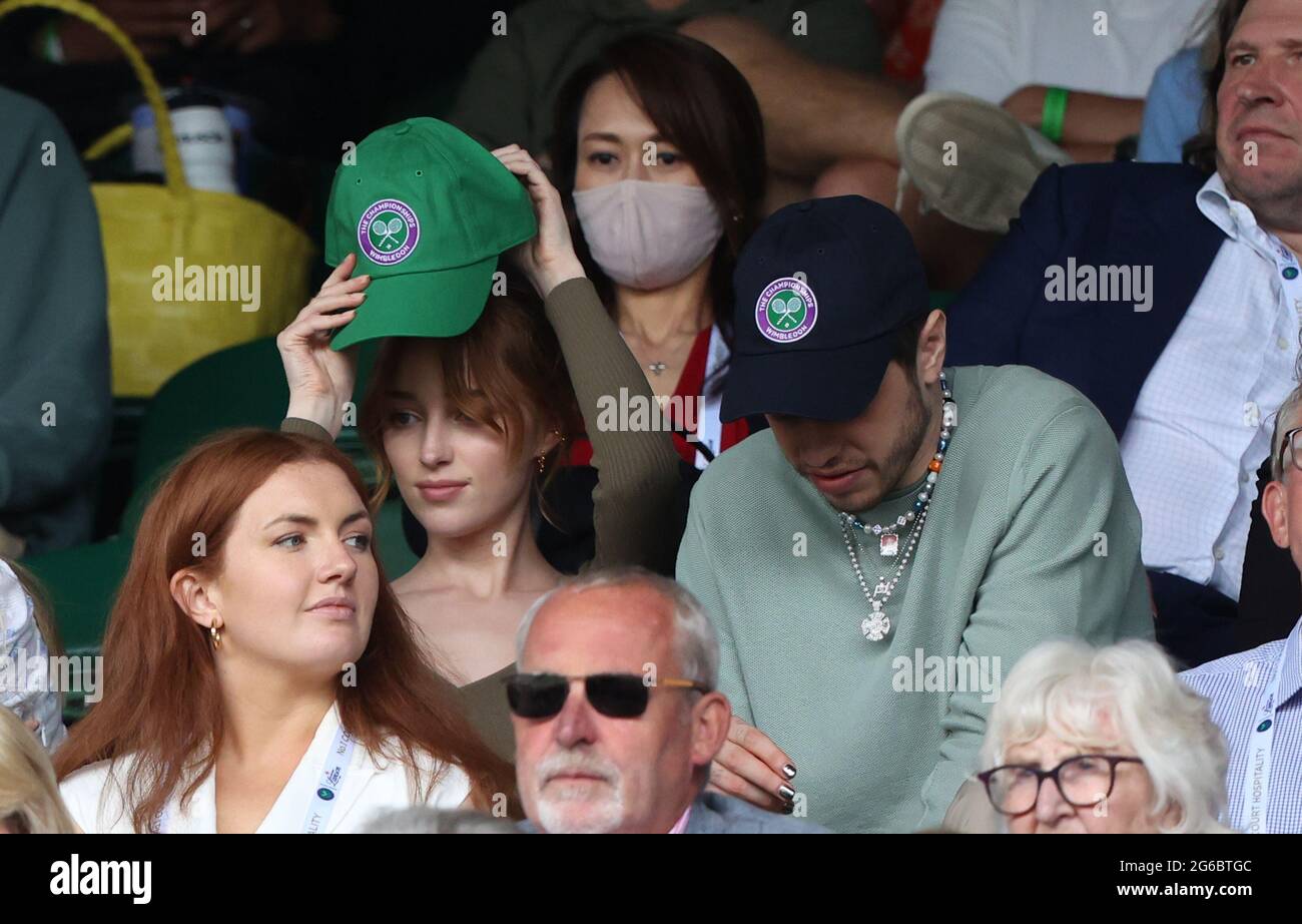 London, UK. 03rd July, 2021. Phoebe Dynevor puts on a cap alongside ...