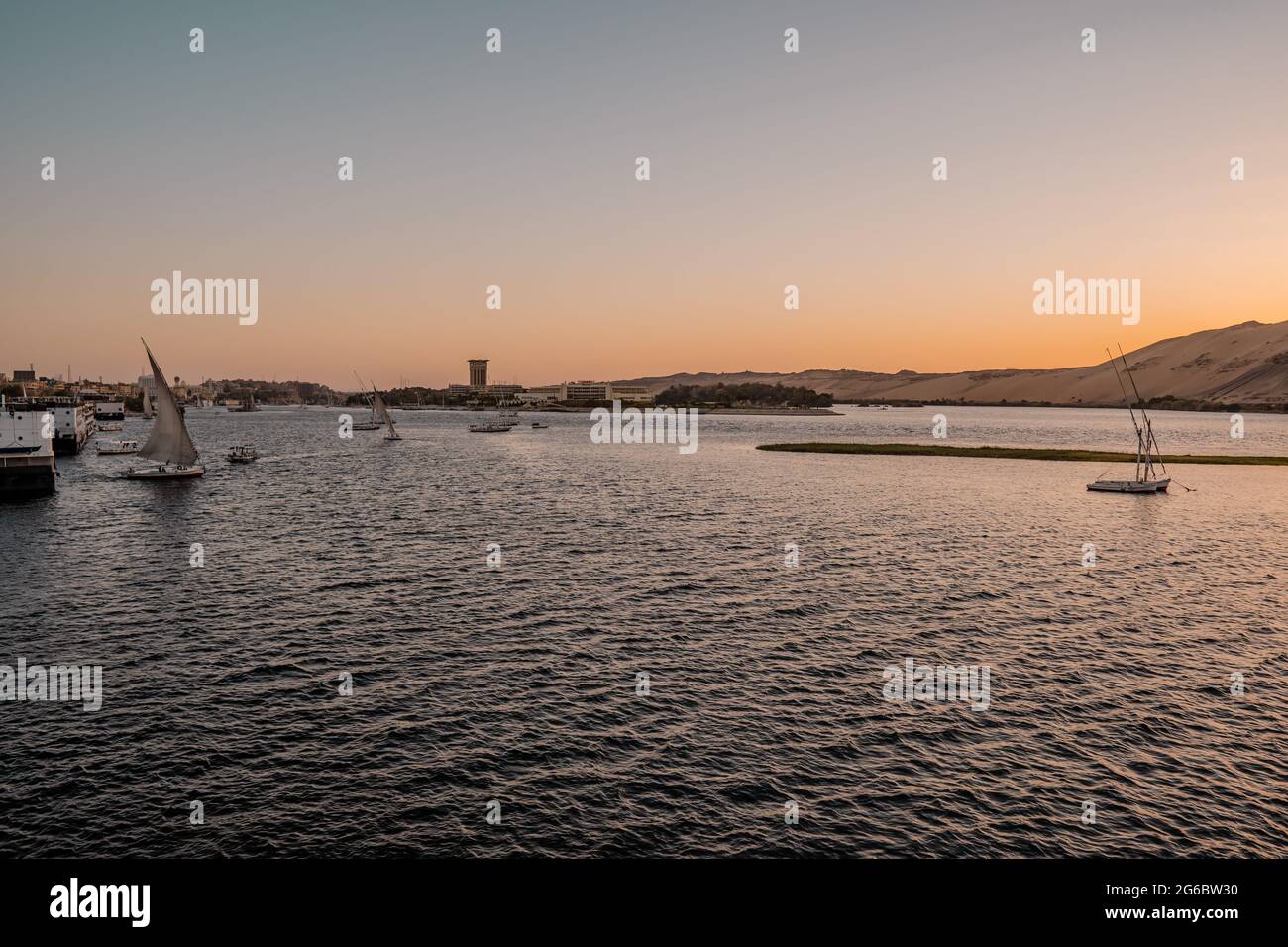Boats on the Nile River at sunset in Aswan, Egypt Stock Photo - Alamy