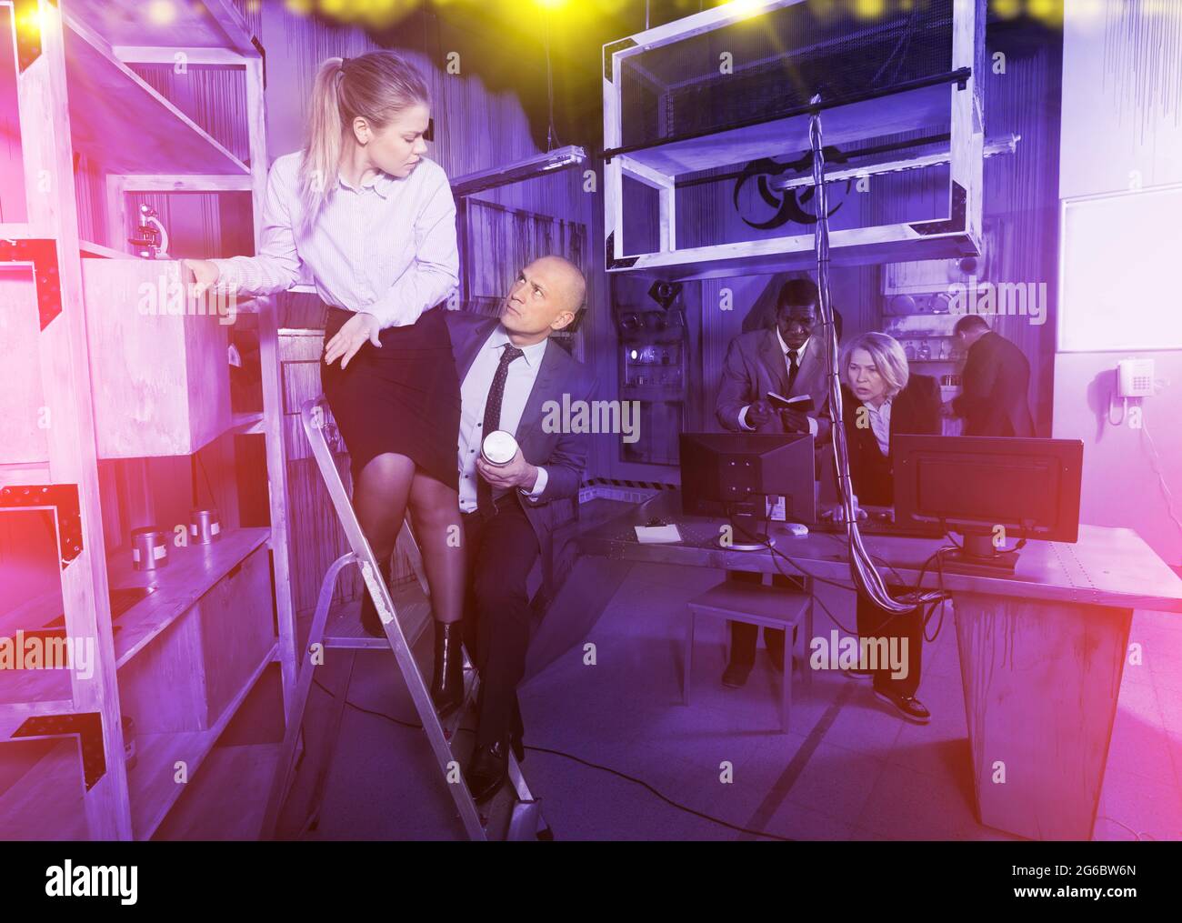Men and women in escape room Stock Photo - Alamy
