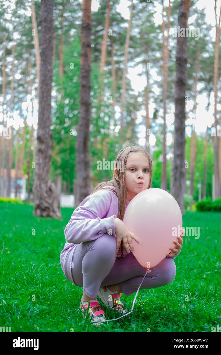 pretty girl tween teenager in purple costume having fun playing with ...
