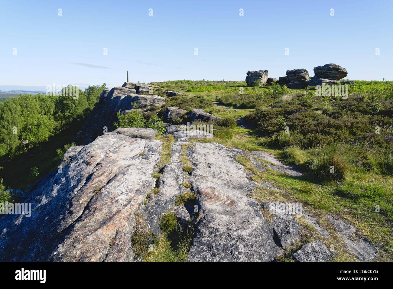 High on the edge of Birchen Edge with multi-coloured gritstone, Nelsons ...