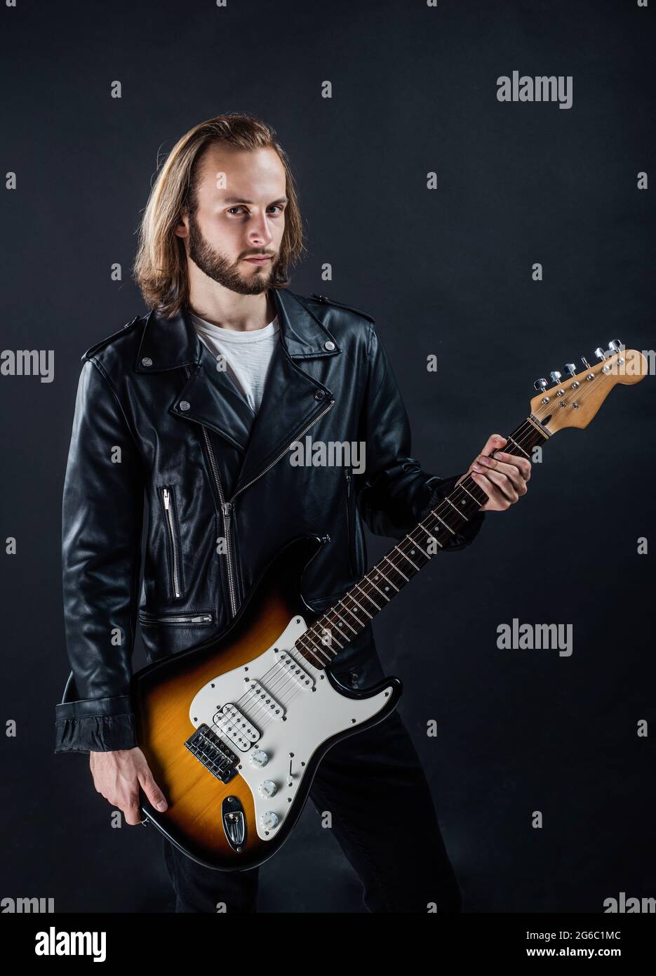 bearded rock musician playing electric guitar in leather jacket, guitar ...