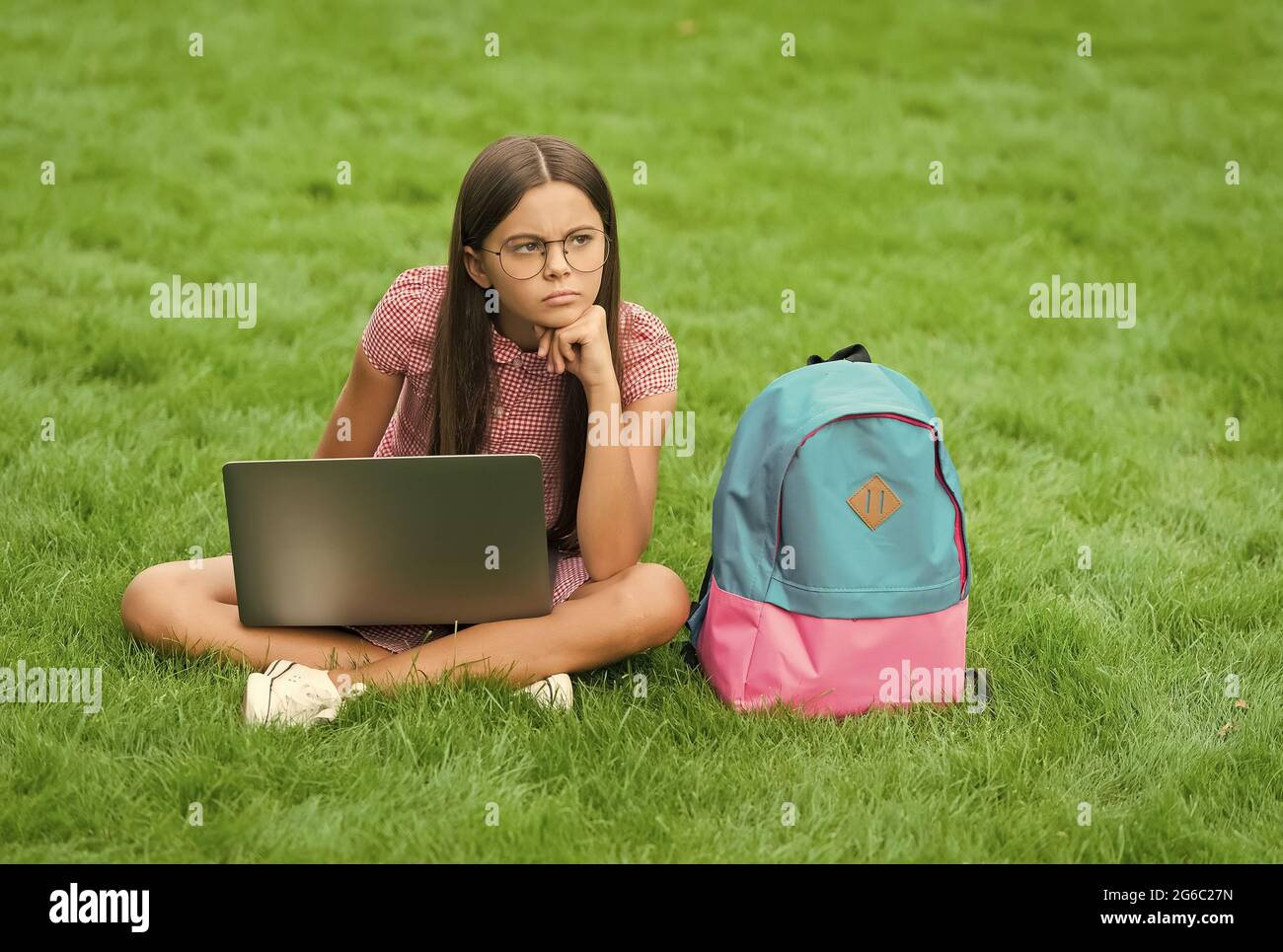 back to school. teen girl use computer on green grass in park. child ...
