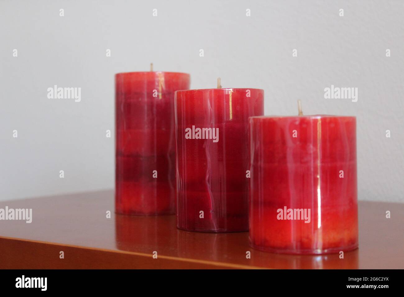 Three red candles hi-res stock photography and images - Alamy