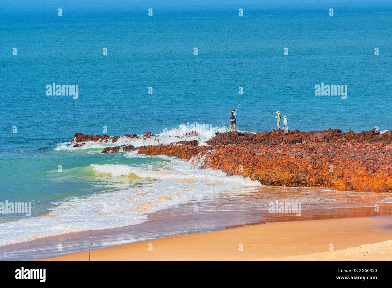 Adult and two children rock fishing, Pender Bay Escape, Dampier ...