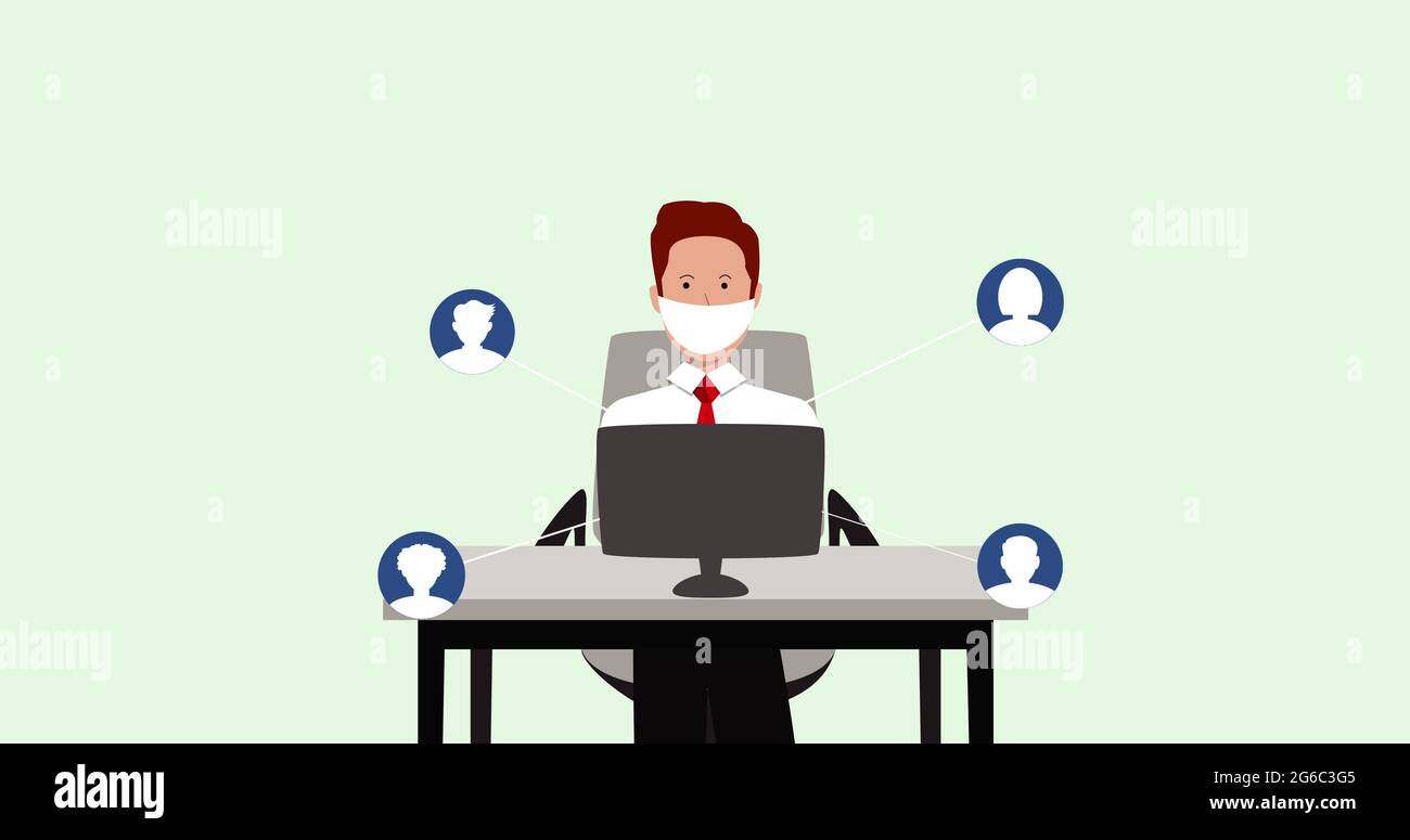 Image of man in face mask networking using computer Stock Photo - Alamy