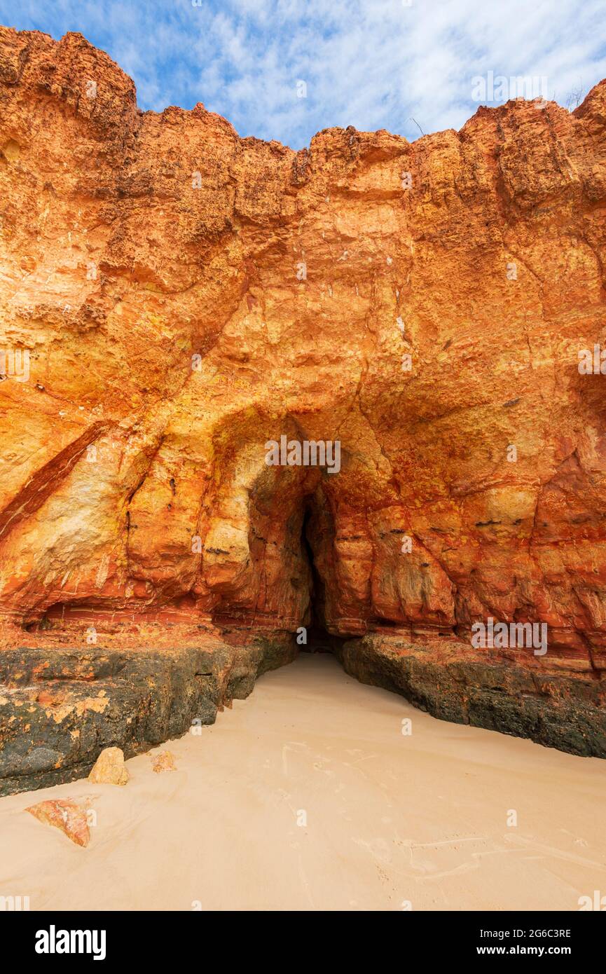 Vertical view of a cave in Pindan cliffs on the beach at Pender Bay ...