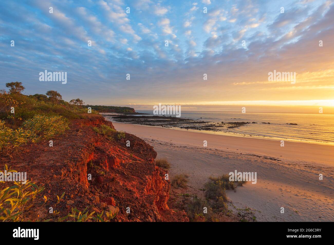 Pastel colours and glowing red Pindan cliffs on the beach over Pender ...