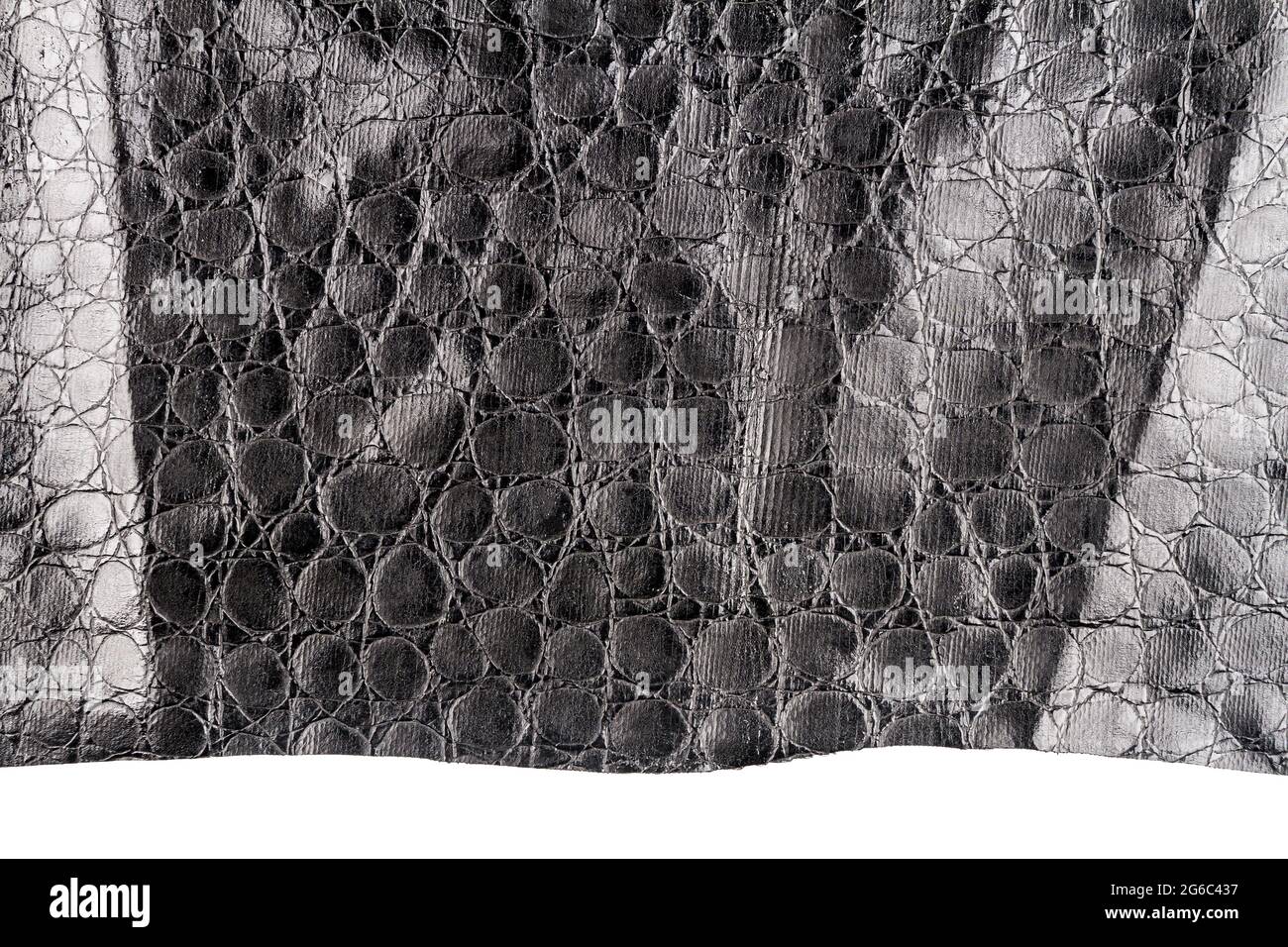 Piece of black artificial leather isolated on white background. Fake ...