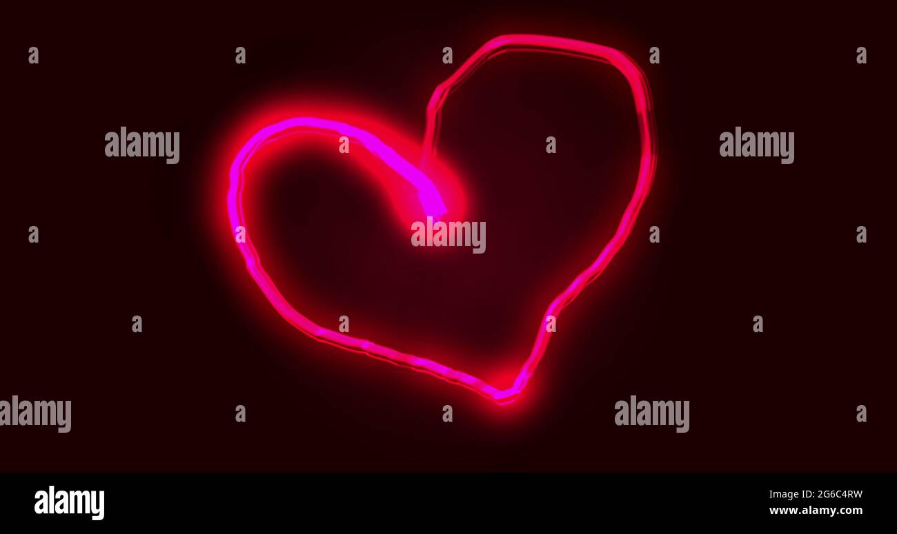 Heart trails forming a heart shape against black background Stock Photo ...