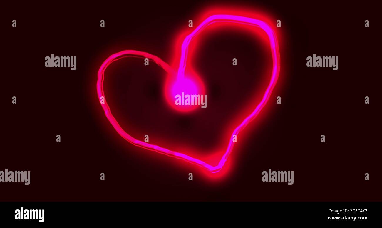 Heart trails forming a heart shape against black background Stock Photo ...