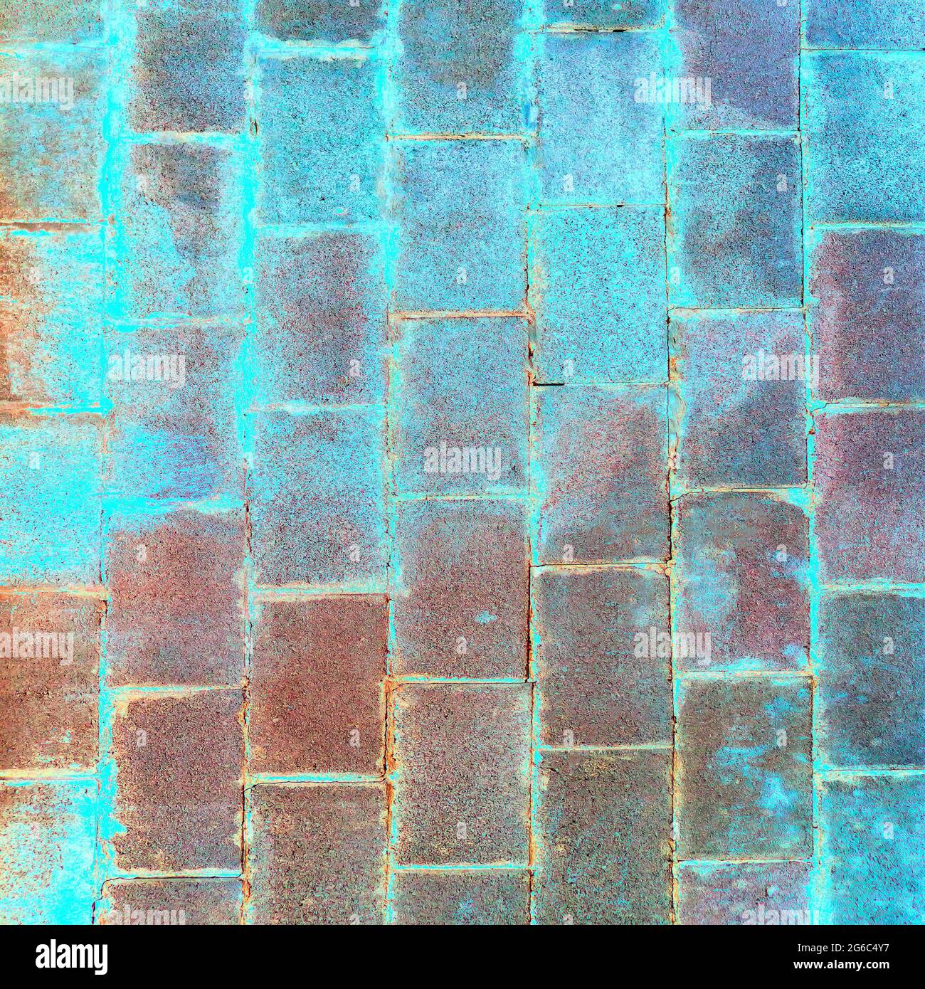 A turquoise-blue wall made of concrete blocks. Background, texture ...