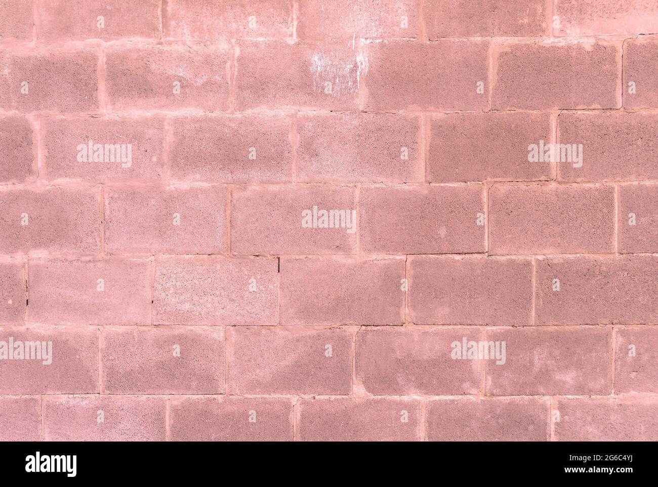 Pink wall made of concrete blocks. Background, texture Stock Photo - Alamy