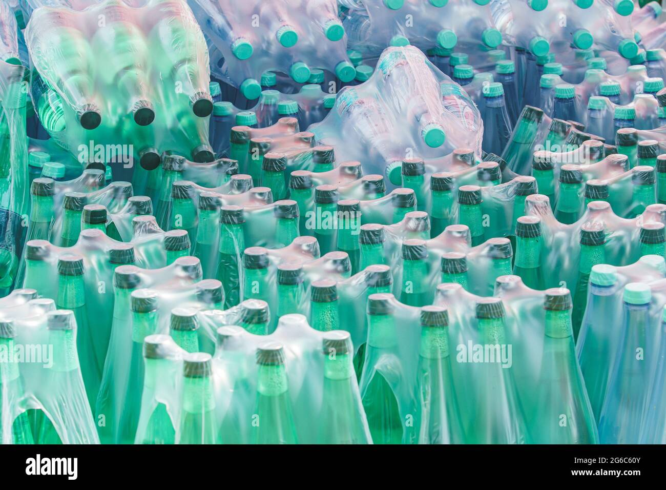 Plastic bottles of water wrapped in plastic membrane Stock Photo - Alamy