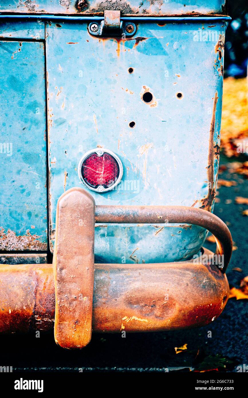 The rusted rear bumper of a rusting vintage VW pickup truck at Bicester ...