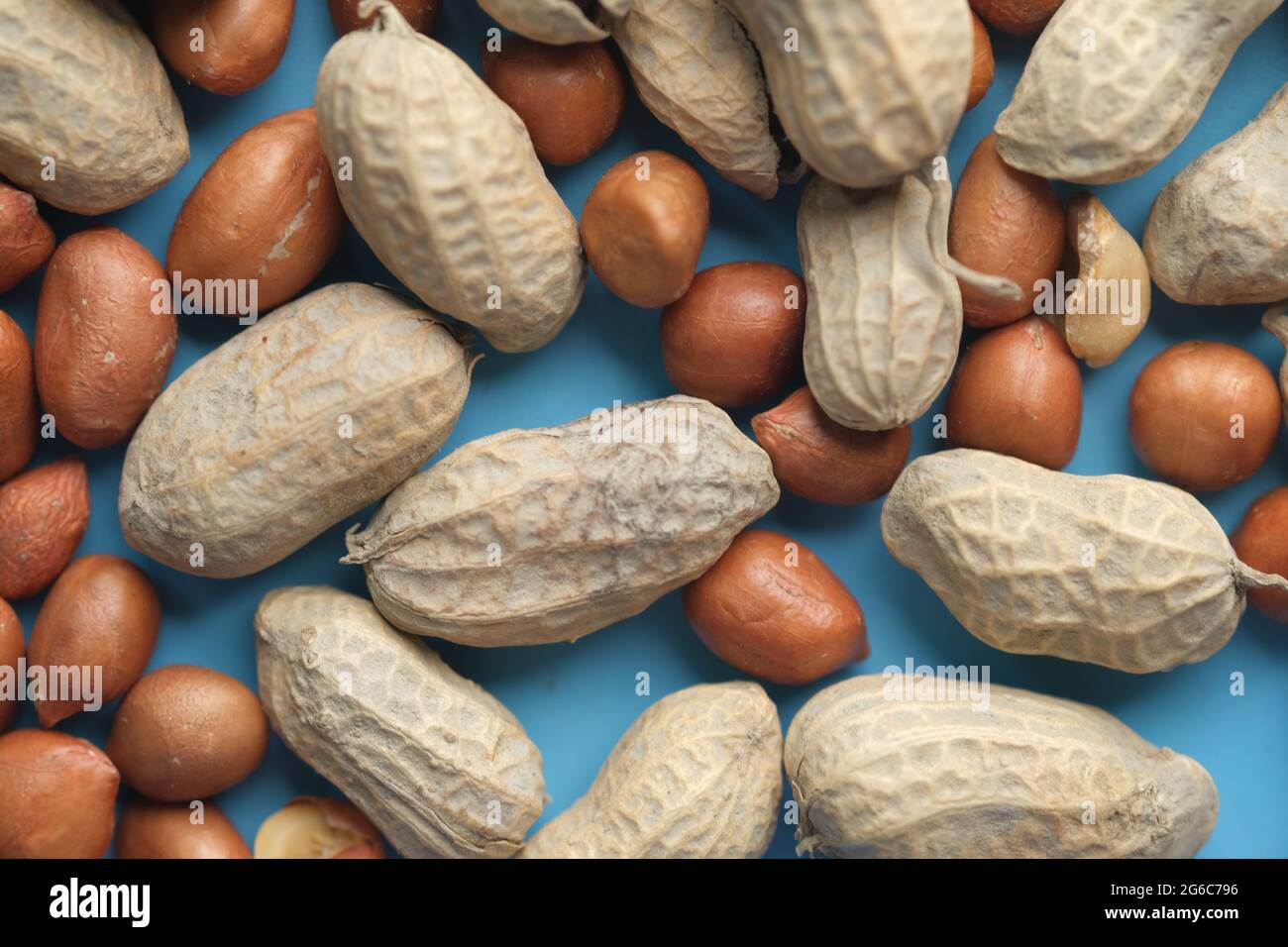 Processed pea nuts on table top down Stock Photo - Alamy