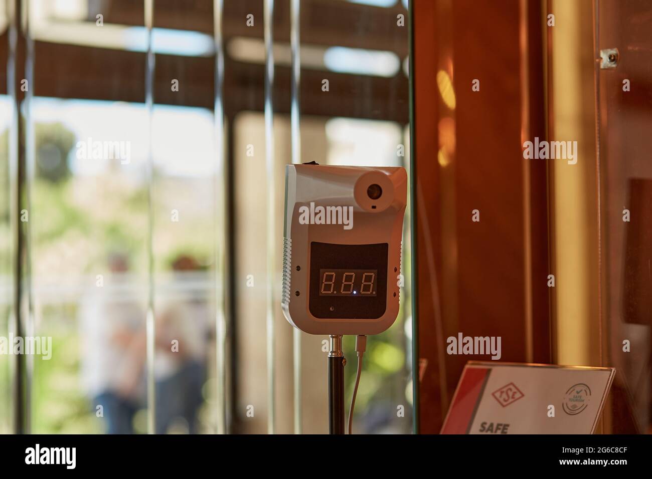 Temperature measuring devicein the hotel lobby. Save tourism concept ...