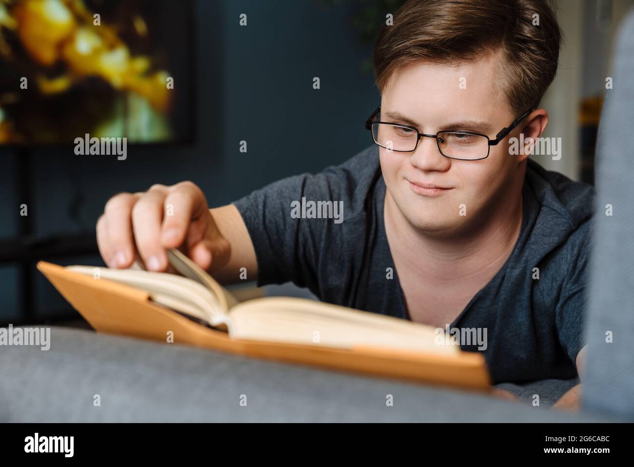 Down syndrome adult reading hi-res stock photography and images - Alamy