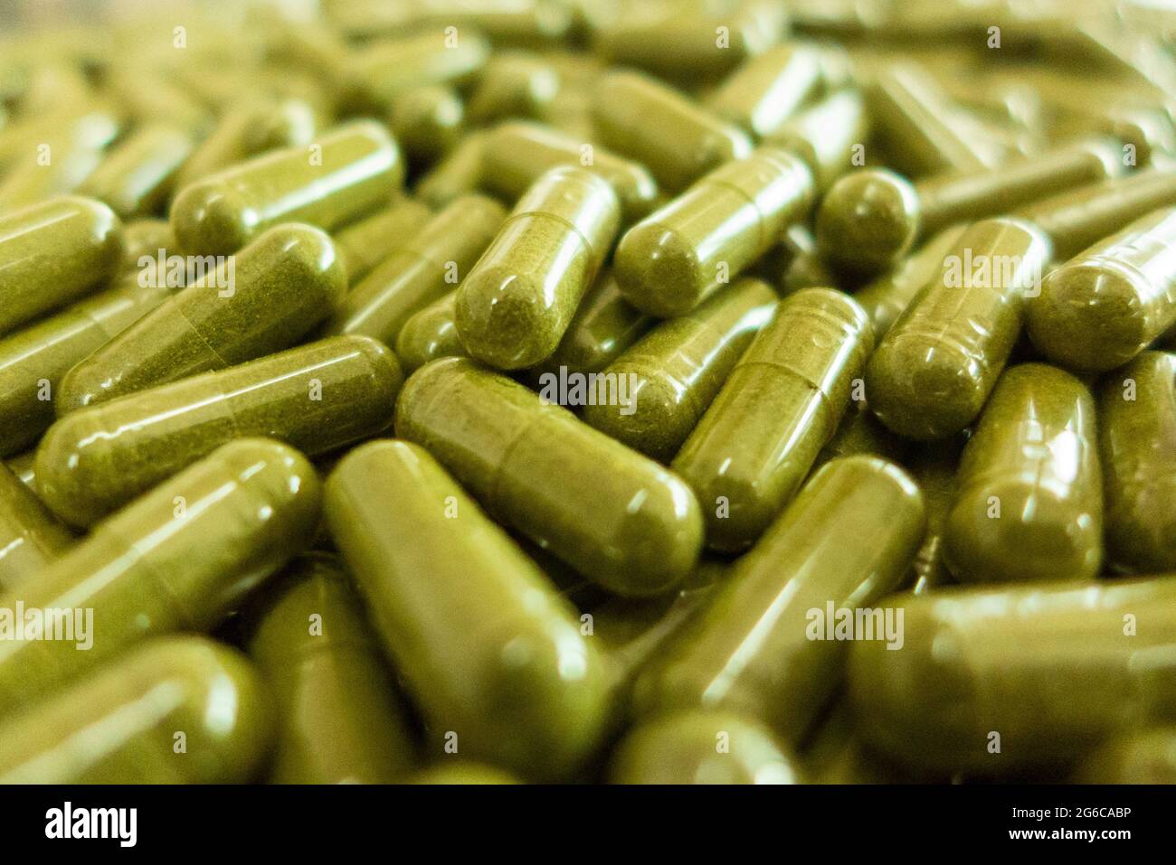 Green herbal capsule hi-res stock photography and images - Alamy
