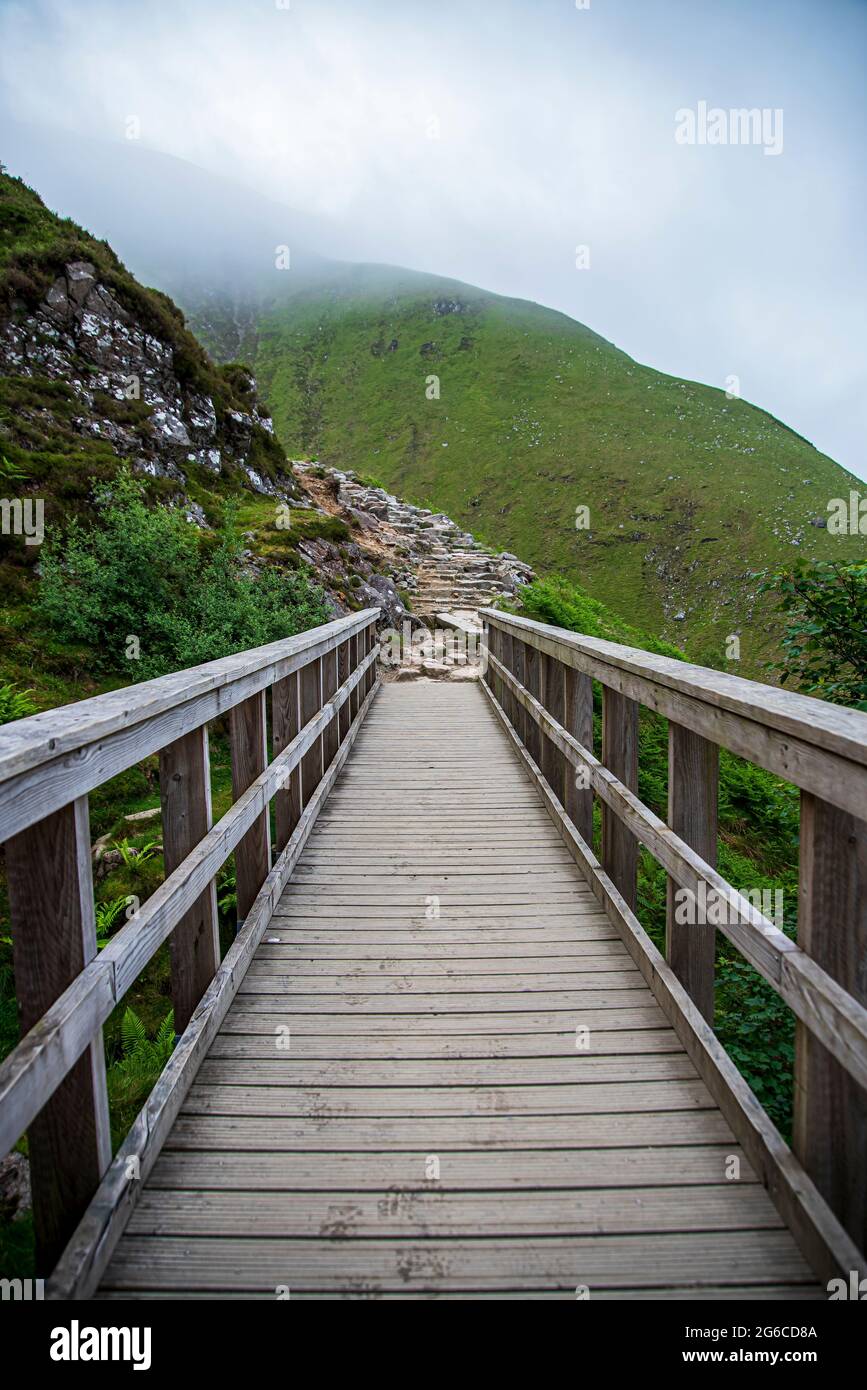 Landscape photography of mountains and wooden bridge, stones, path, Ben ...