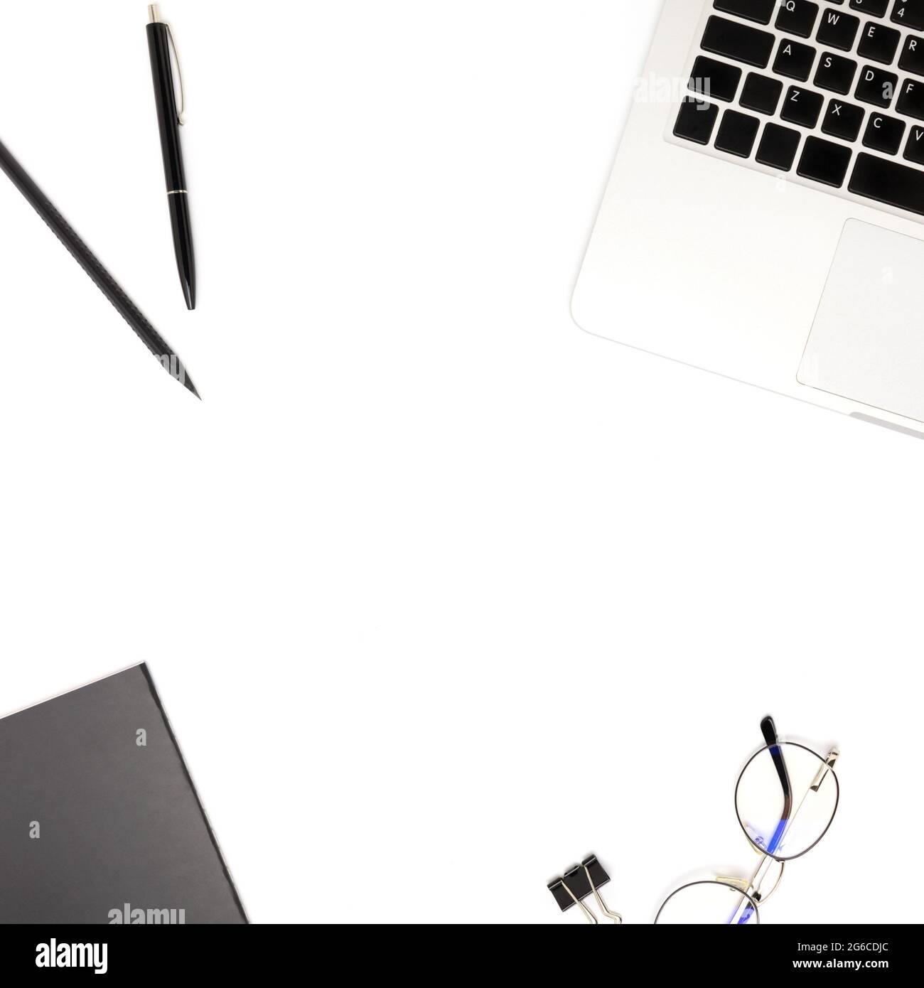 Frame made of laptop and office supply on a white background. Workspace ...