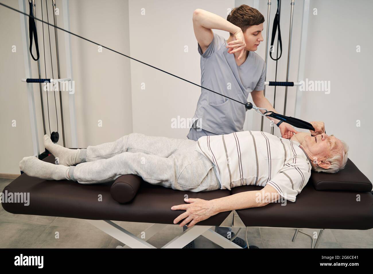 Orthopedic surgeon showing correct pulling movement for exercise to ...