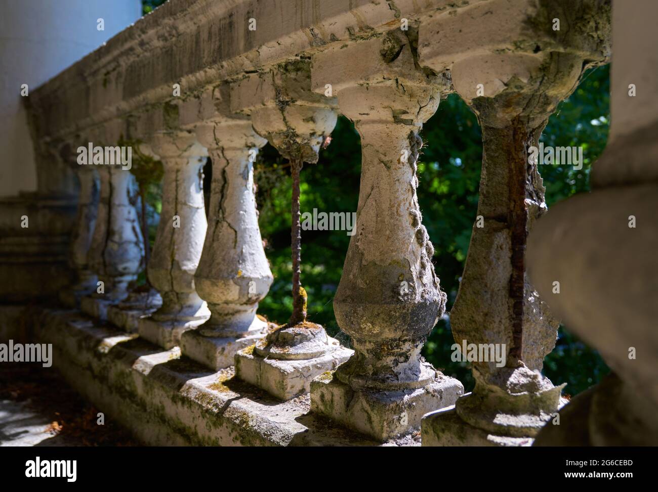 Abandoned Building Decay. An old railing with crumbling antique pillars ...