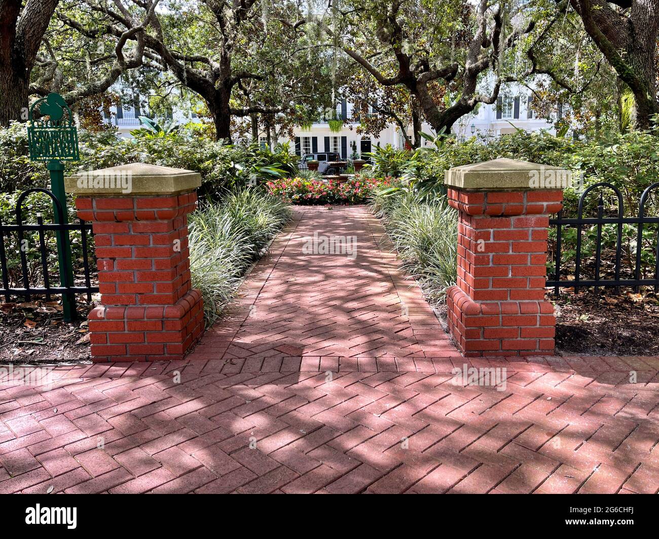 A small park with a path that leads to a fountain in Orlando, Florida ...