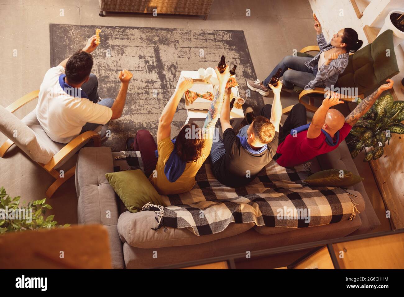 Group of friends watching TV, sport match together. Concept of ...