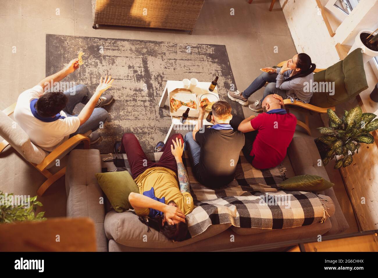 Group of friends watching TV, sport match together. Concept of ...