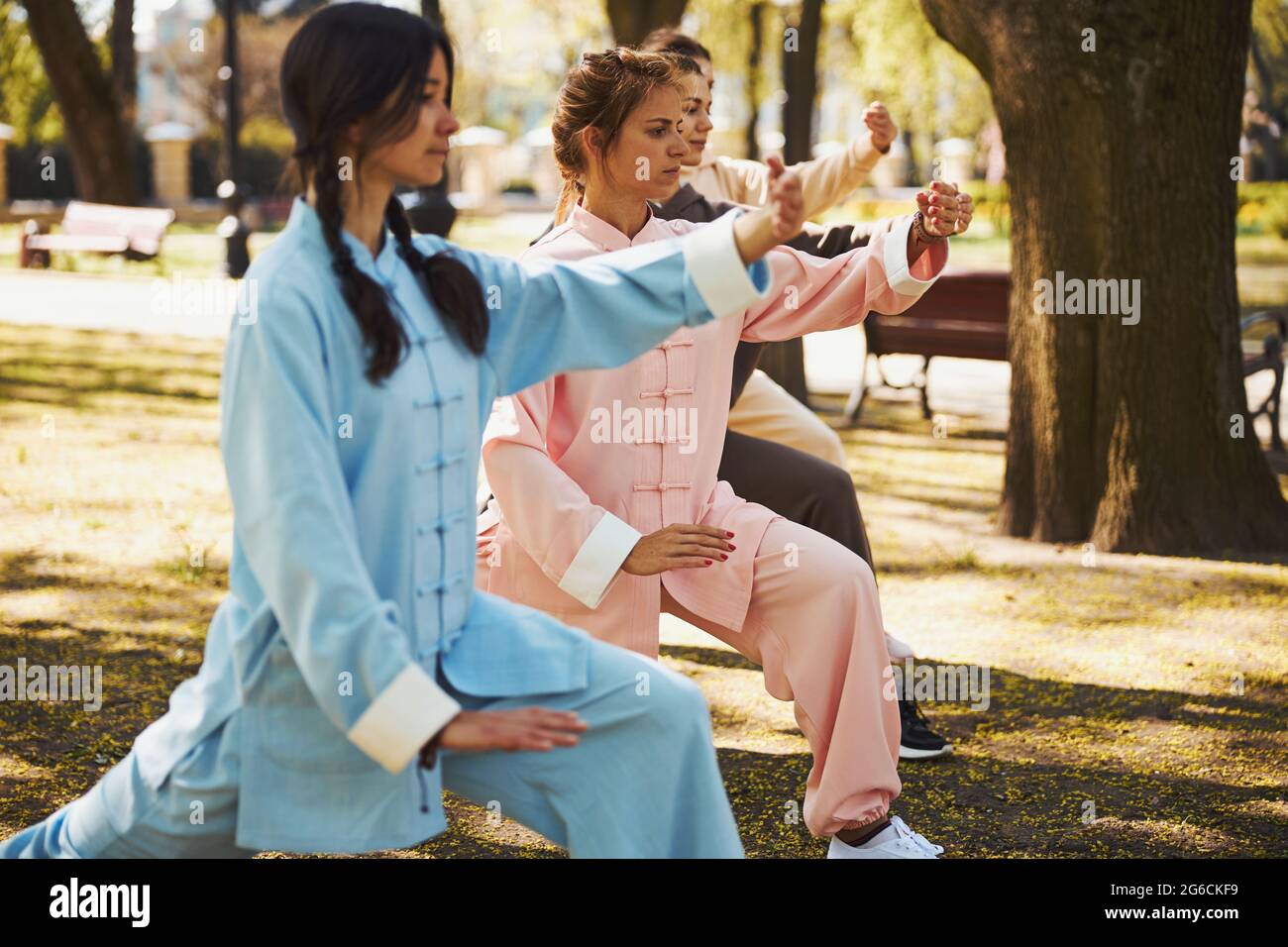Practice of parting the wild horse mane by four women Stock Photo - Alamy