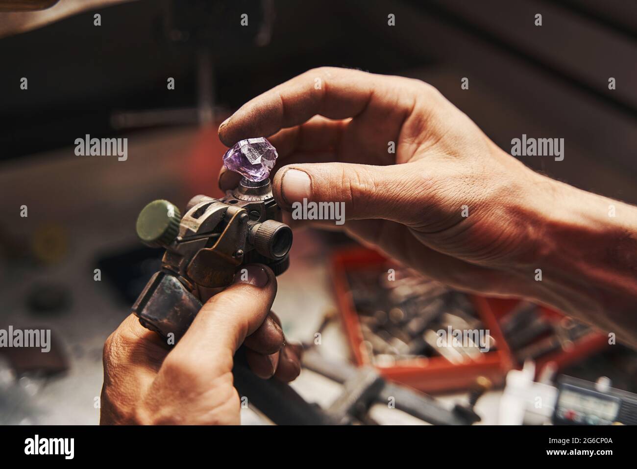 Man putting gemstone jewelry item hi-res stock photography and images ...
