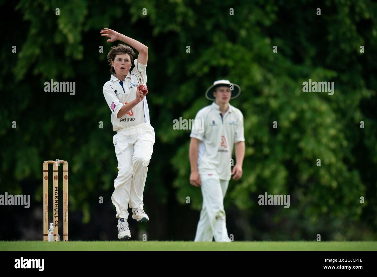 Young cricket bowler in action Stock Photo - Alamy