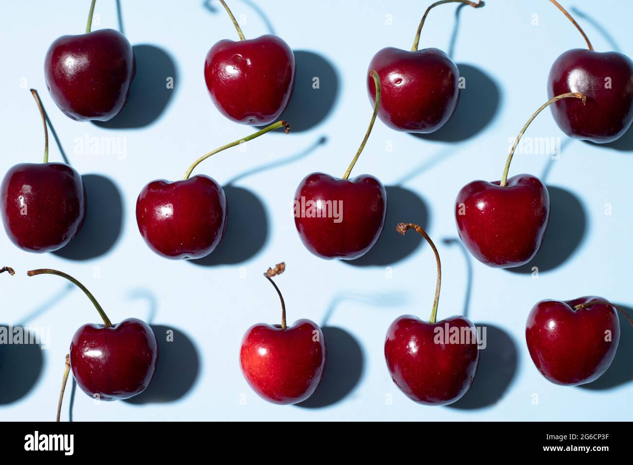background of cherries arranged in a chess shape Stock Photo - Alamy