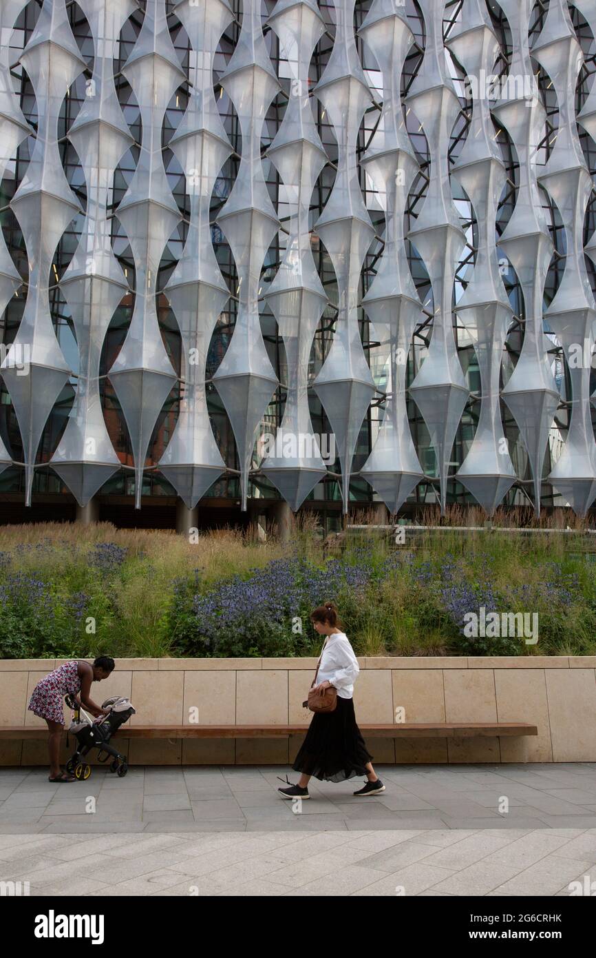 Two women walking past the new American Embassy designed by architects ...