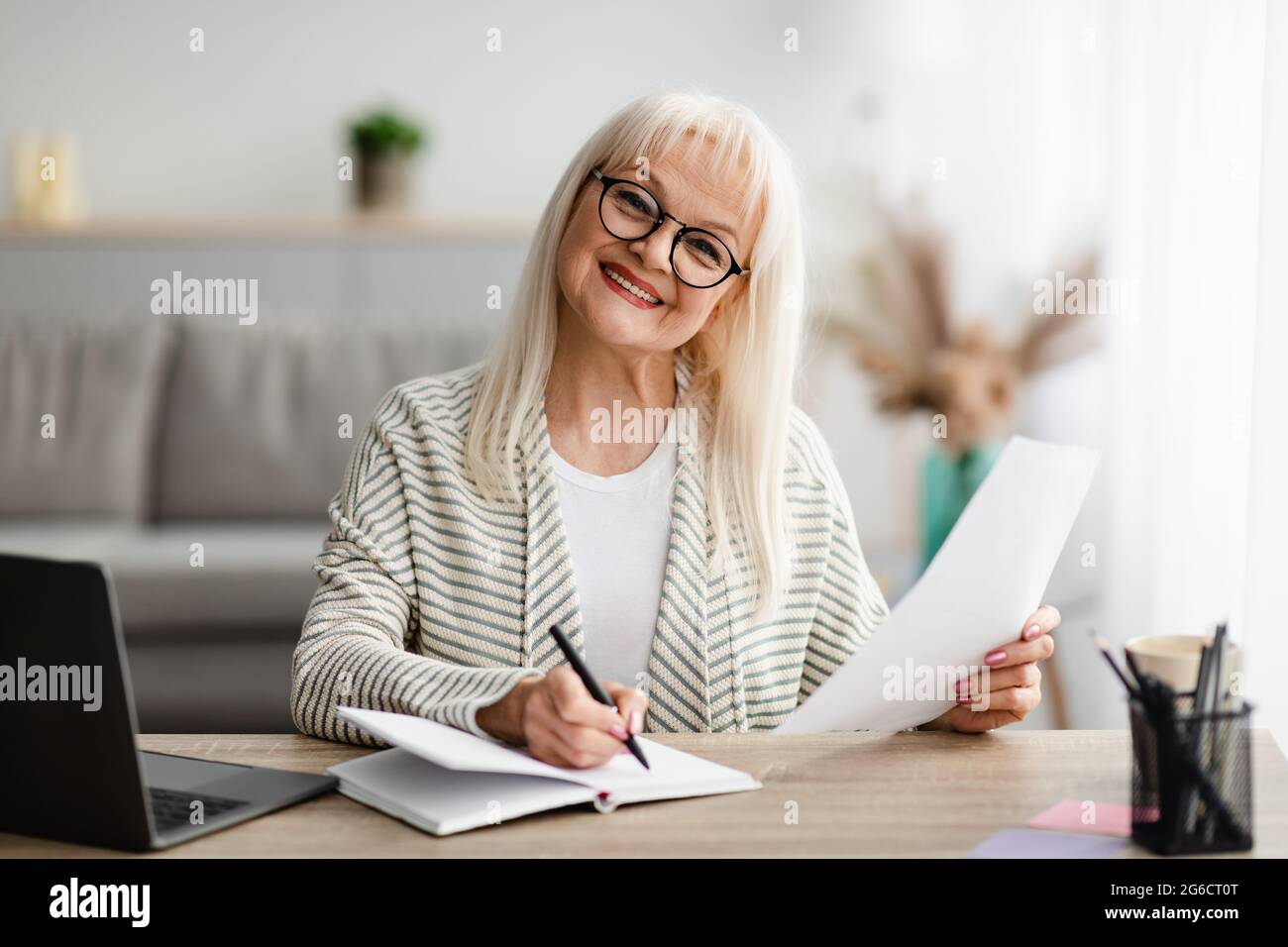 Elderly woman writing letter hi-res stock photography and images - Alamy