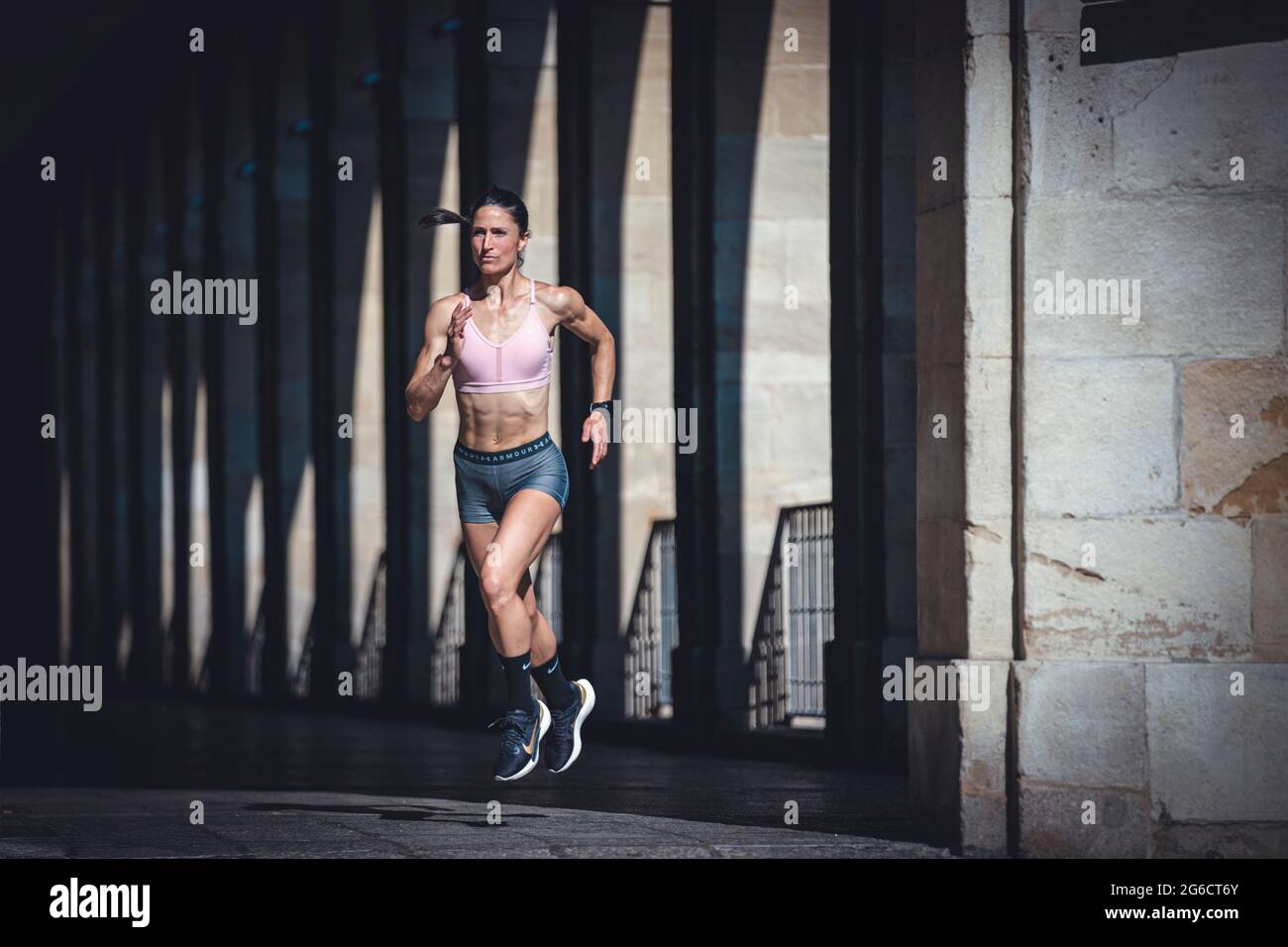 Girl running in the city, it's her lifestyle Stock Photo - Alamy