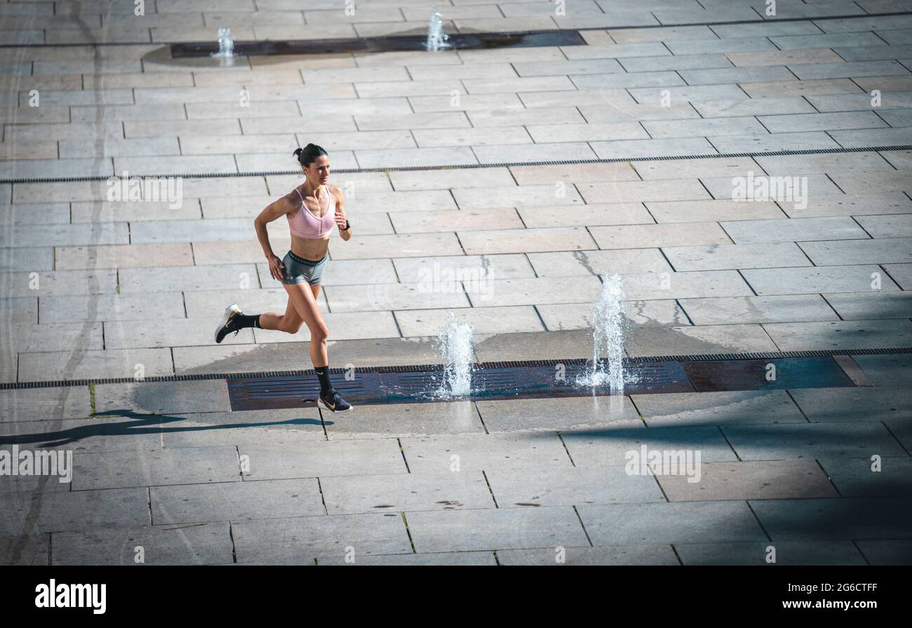Girl running in the city, it's her lifestyle Stock Photo - Alamy