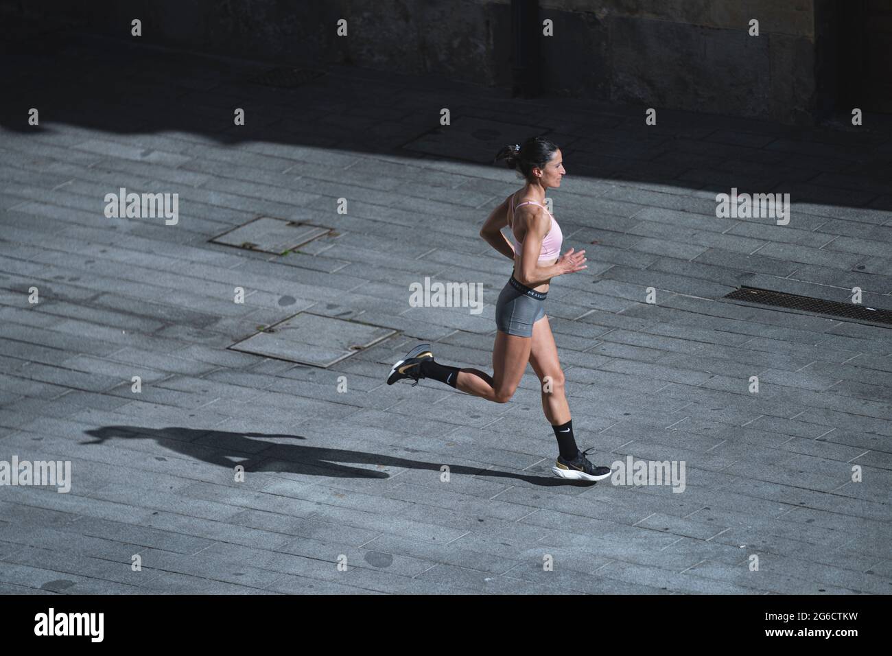 Girl running in the city, it's her lifestyle Stock Photo - Alamy