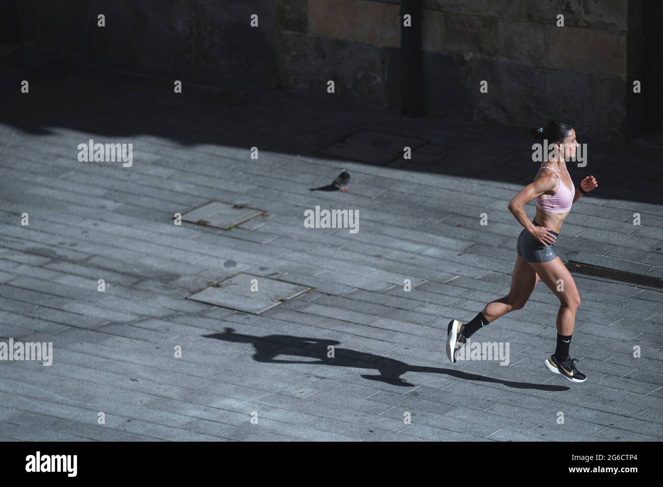 Girl running in the city, it's her lifestyle Stock Photo - Alamy