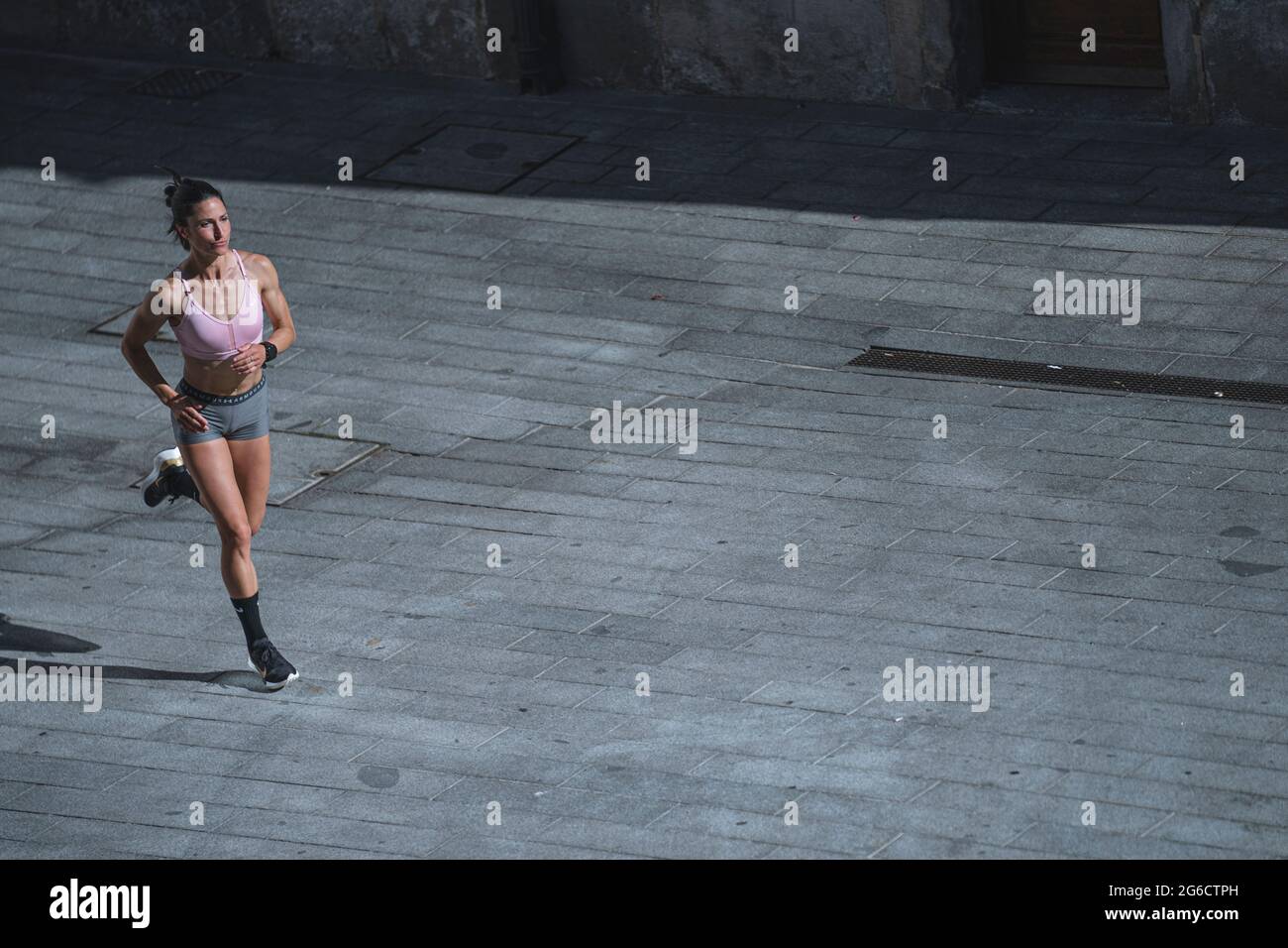 Girl running in the city, it's her lifestyle Stock Photo - Alamy