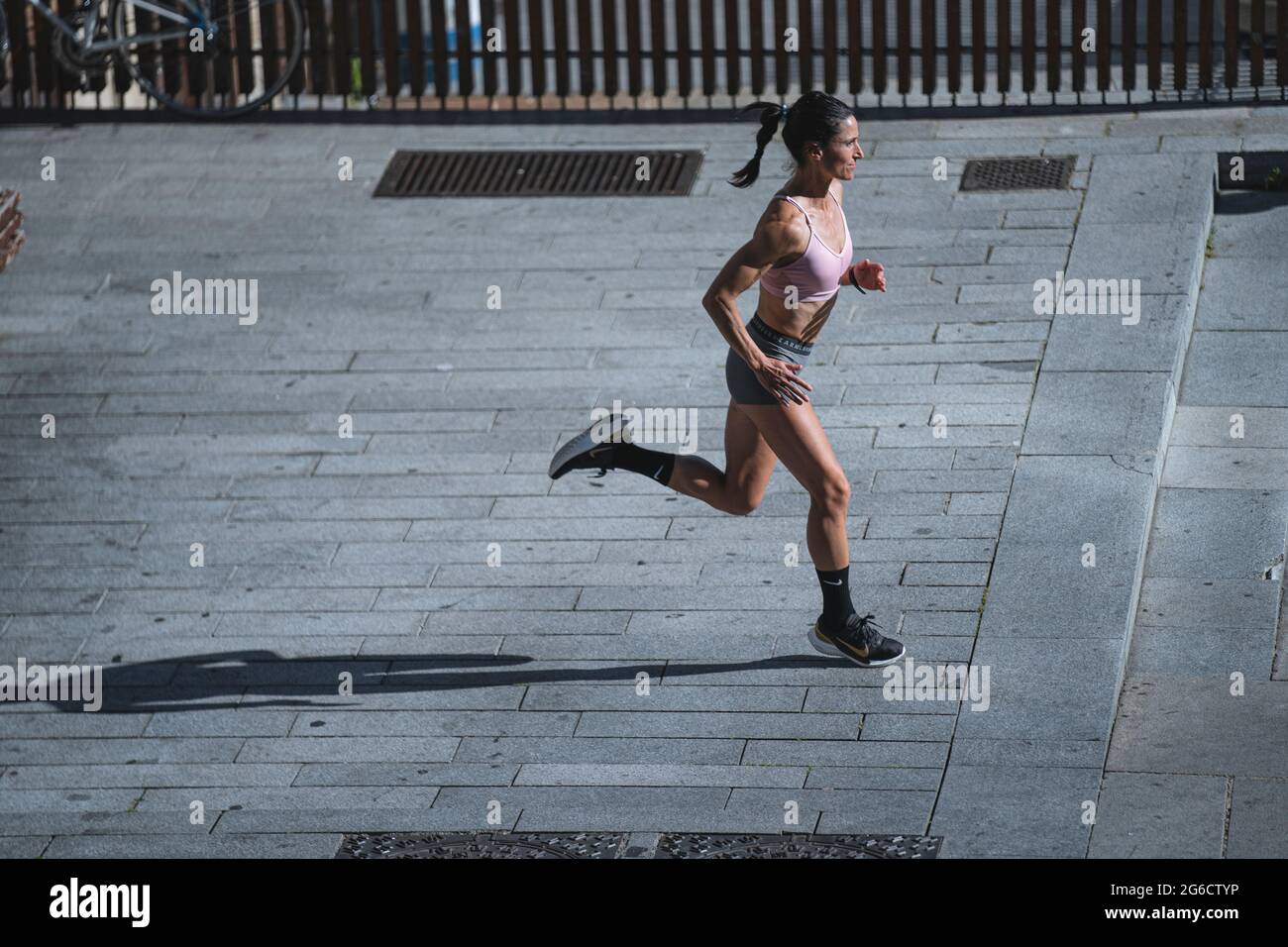Girl running in the city, it's her lifestyle Stock Photo - Alamy